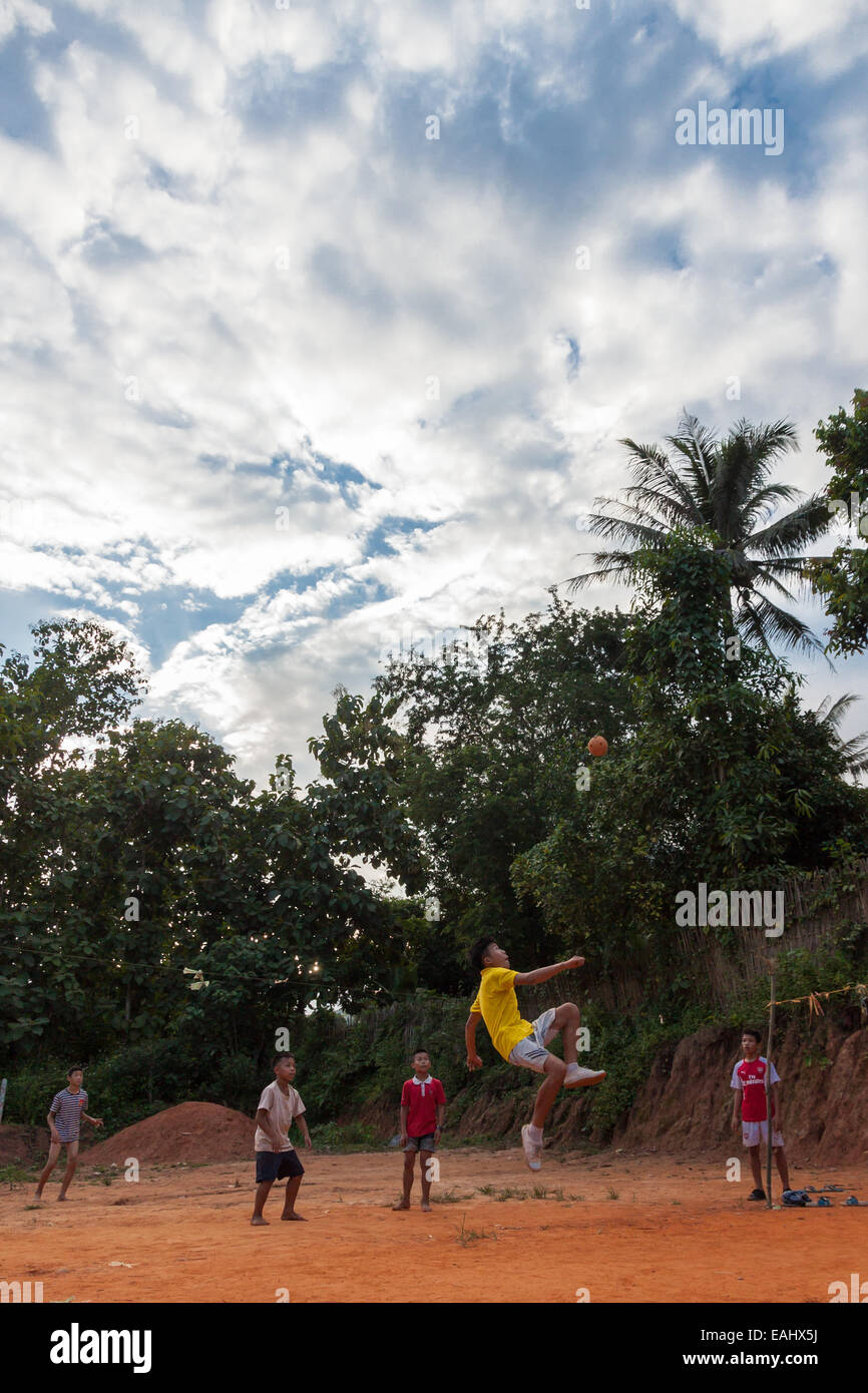 Acrobatic Lao children playing Rattan Ball Stock Photo - Alamy