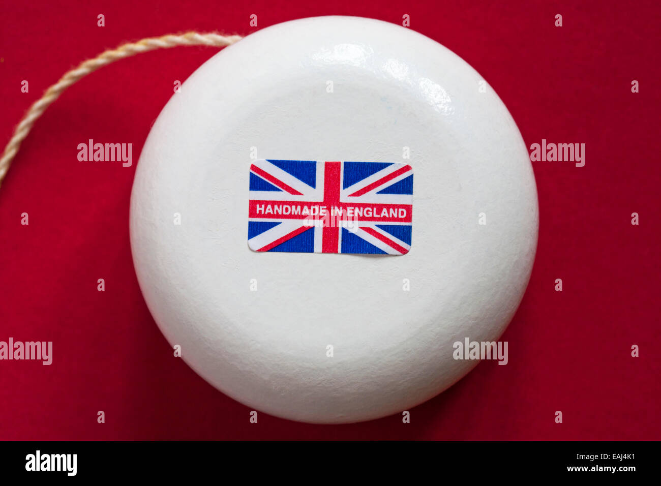 Handmade in England Union Jack label on yoyo set on red background ...