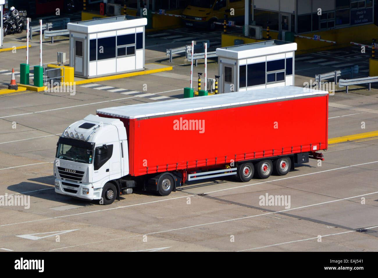 Iveco truck and red soft sided trailer with side curtain access ...