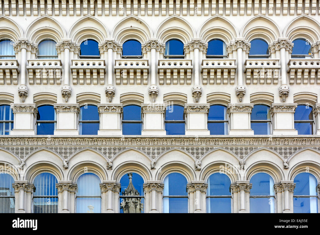 Elevation of London office building with rows of arches and windows ...