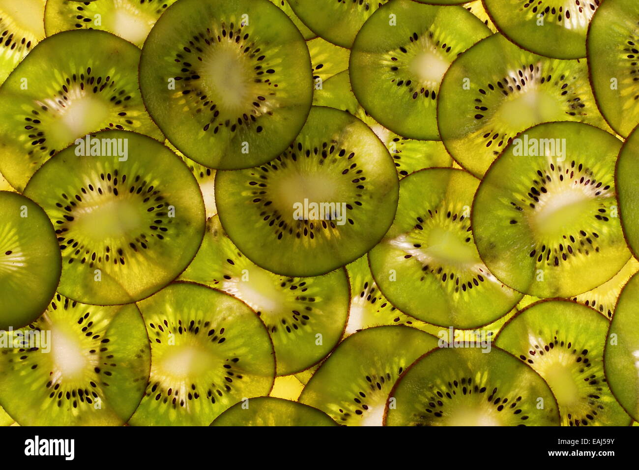 Kiwi fruit sliced as a background, top view Stock Photo - Alamy
