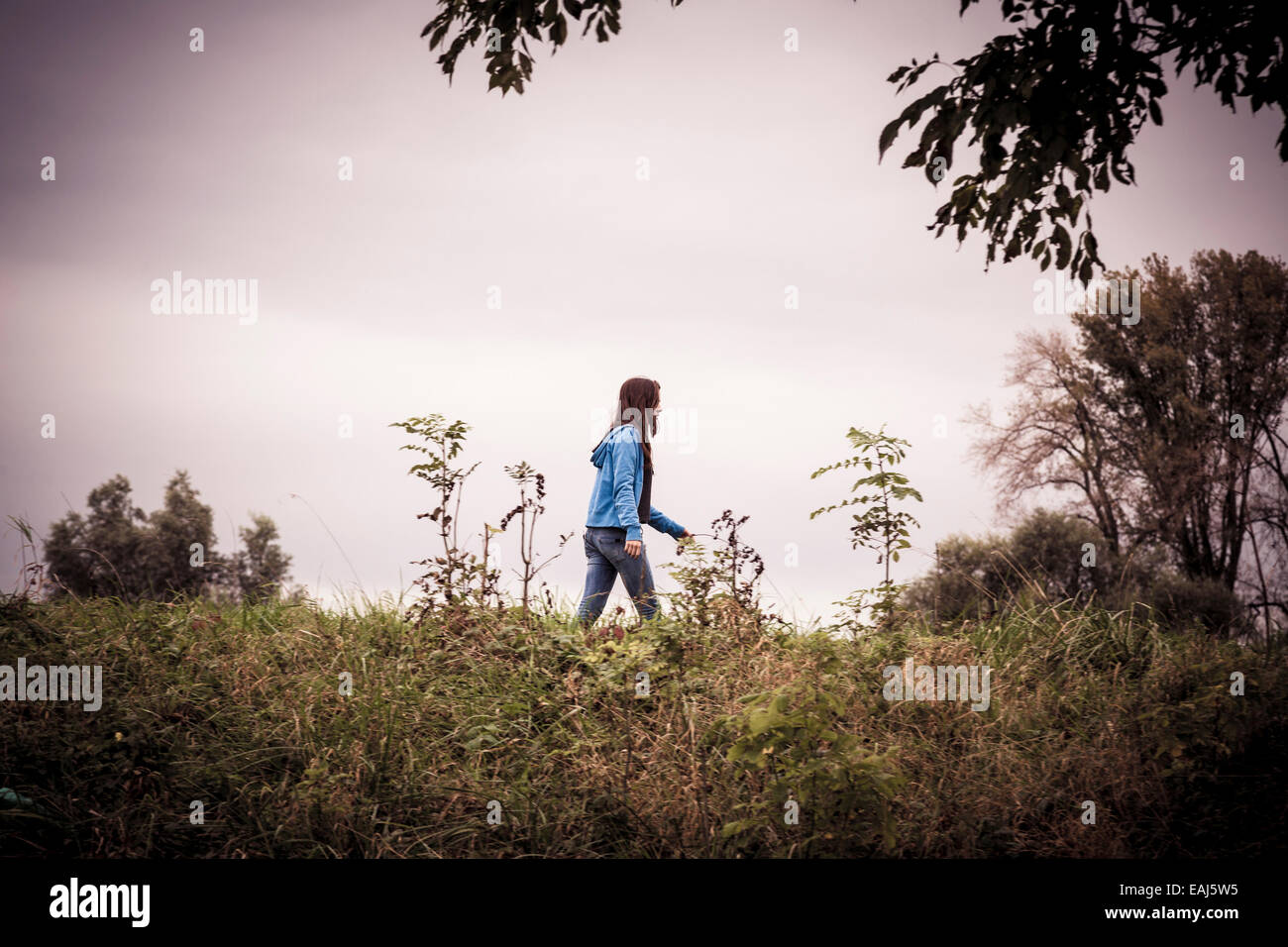 Sad teen girl walking hi-res stock photography and images - Alamy