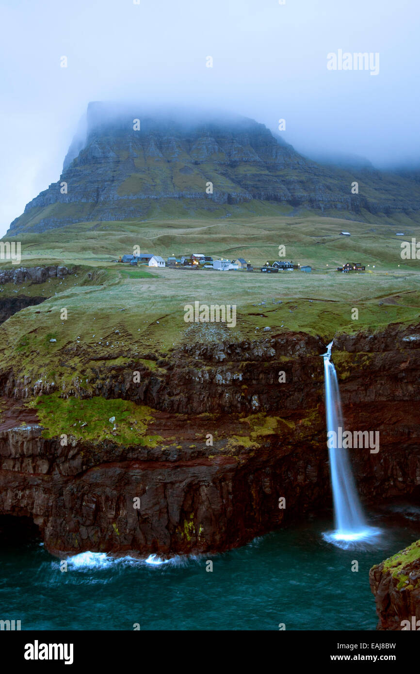 Mulafossur waterfall at dusk, Gasadalur village, Faroe Islands Stock ...