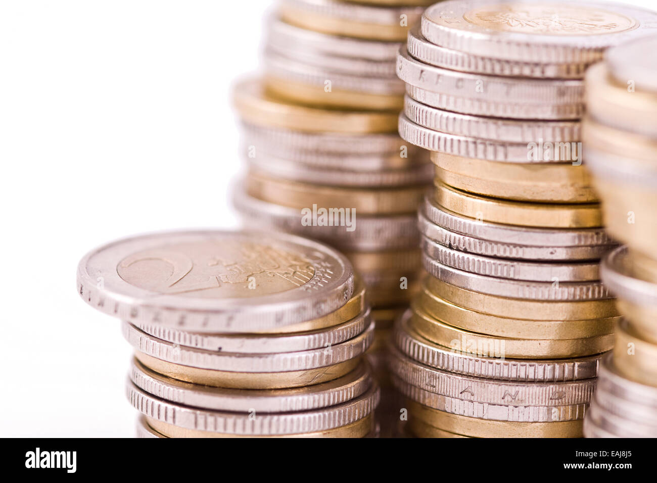 Piles of shiny coins isolated on white, defocused money closeup Stock ...