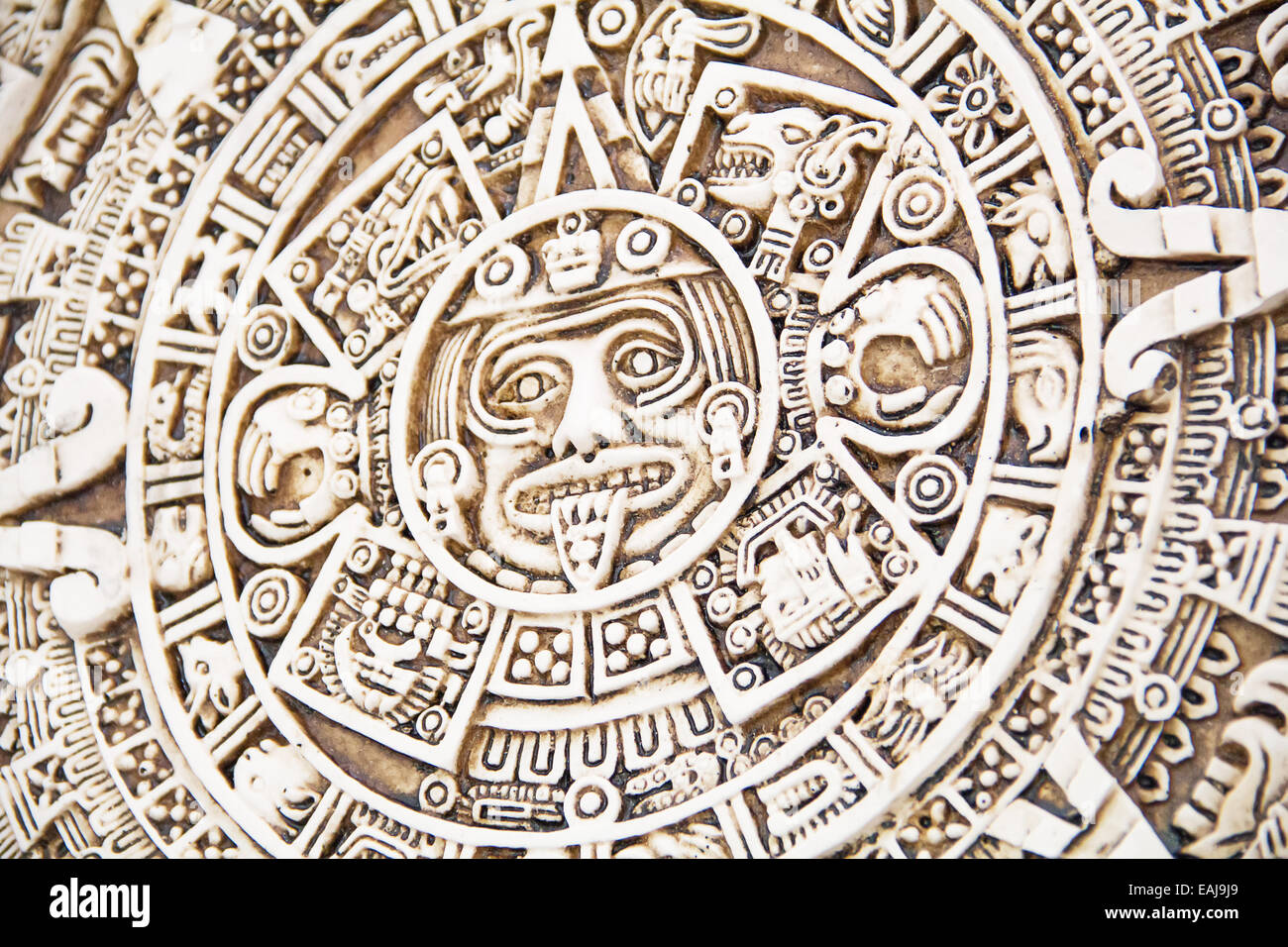 Fragment of the Mayan symbolic sun carved on the stone Stock Photo - Alamy