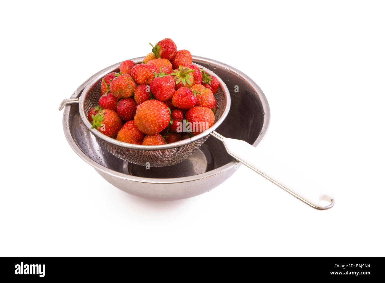 Fresh tasty strawberries in a colander isolated on white Stock Photo ...