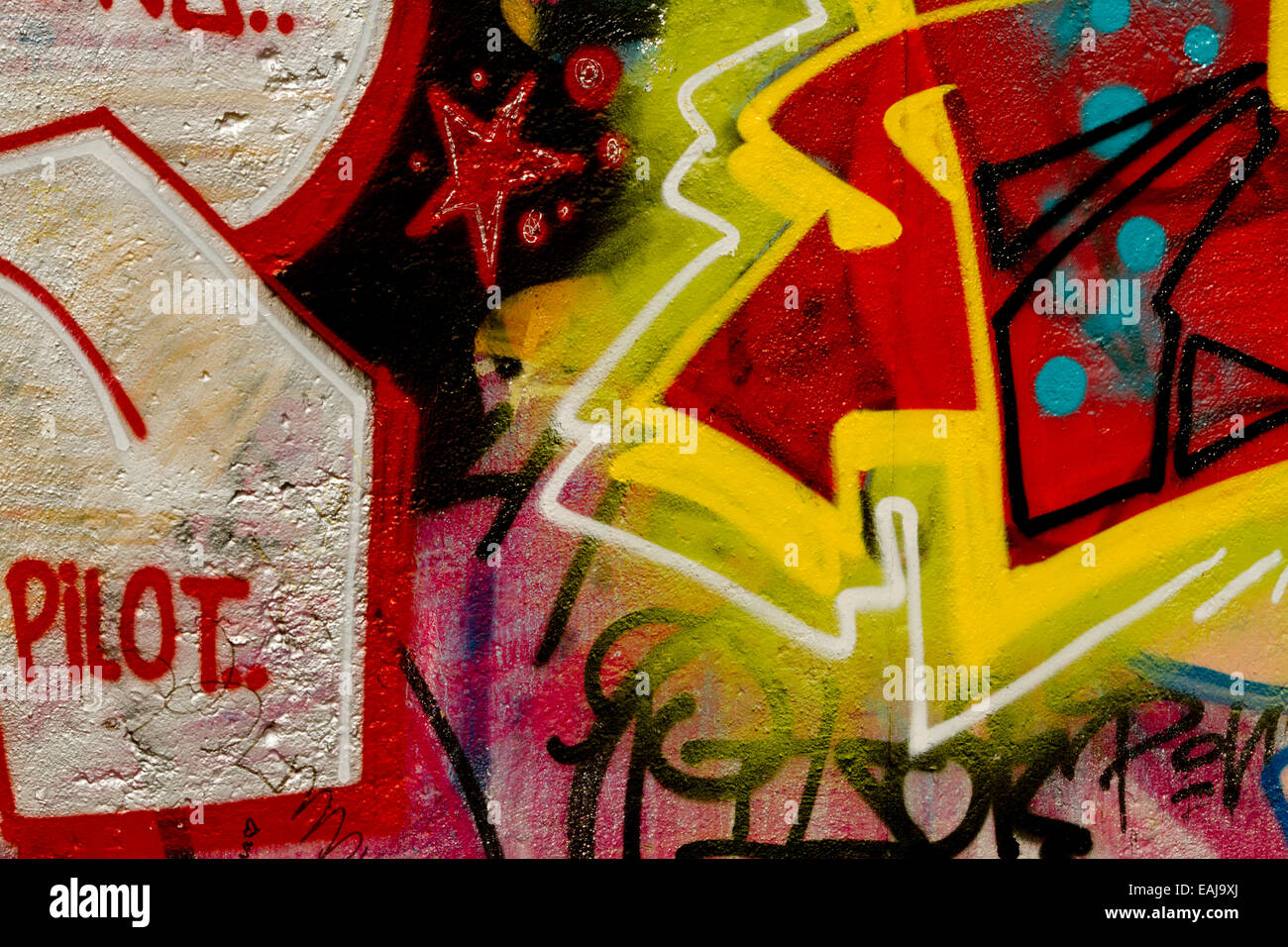 Graffiti art urban Berlin Wall pilot Tag arrow Stock Photo - Alamy