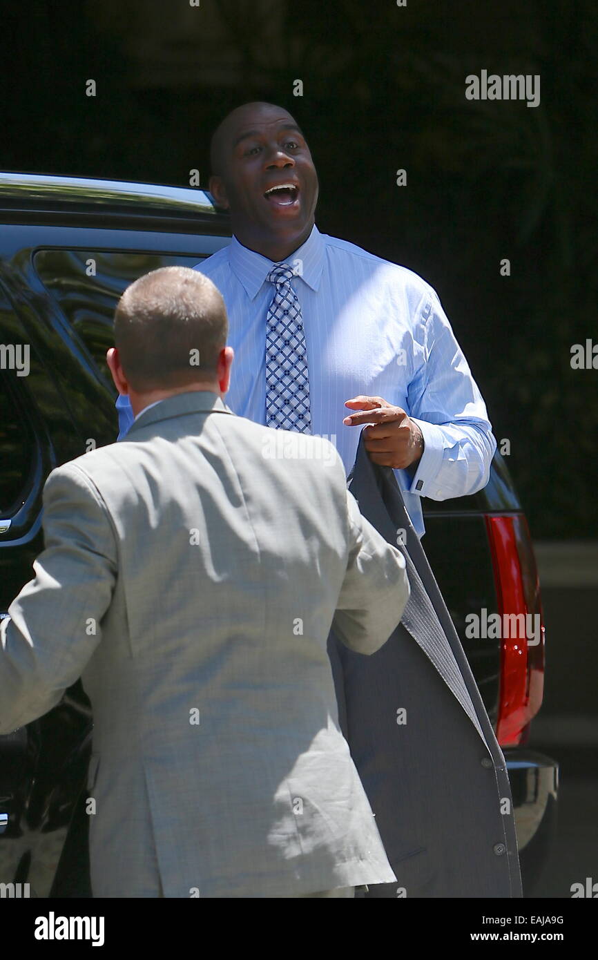 Magic Johnson seen getting into a waiting car at the Four Seasons hotel ...