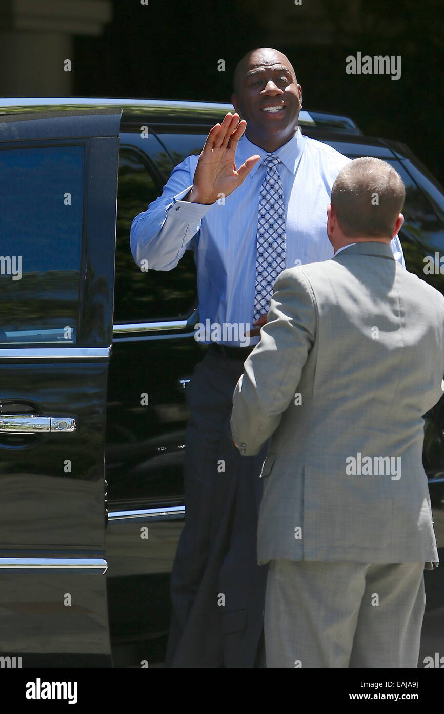 Magic Johnson seen getting into a waiting car at the Four Seasons hotel ...