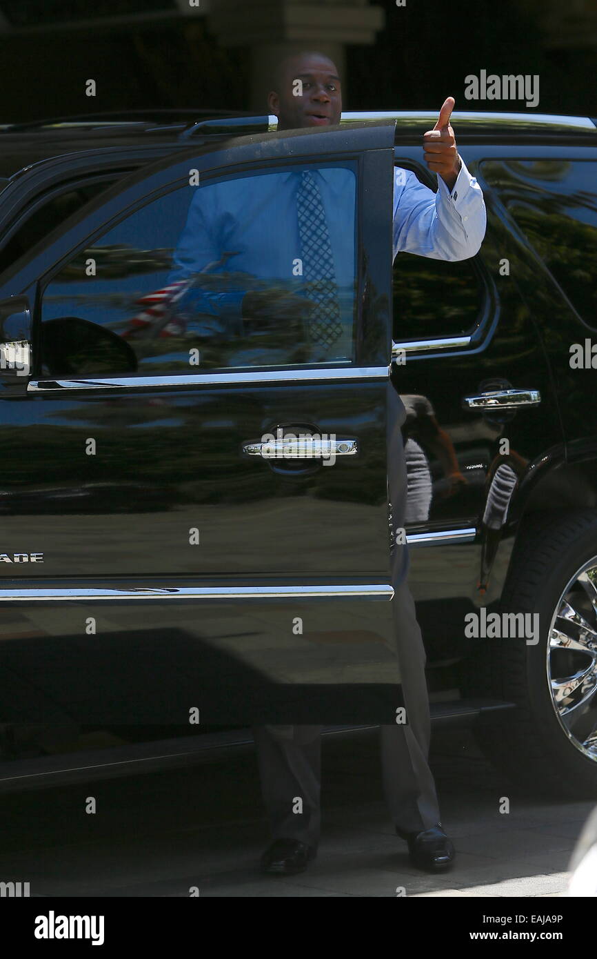 Magic Johnson seen getting into a waiting car at the Four Seasons hotel ...