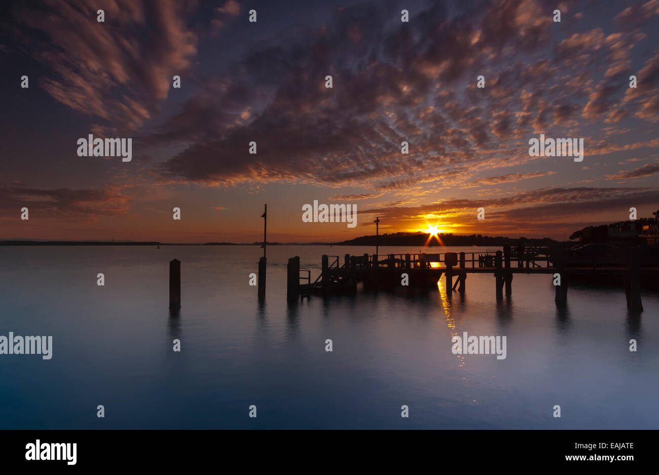 Sunset over Brownsea Island in Poole Harbour, Dorset, the second ...