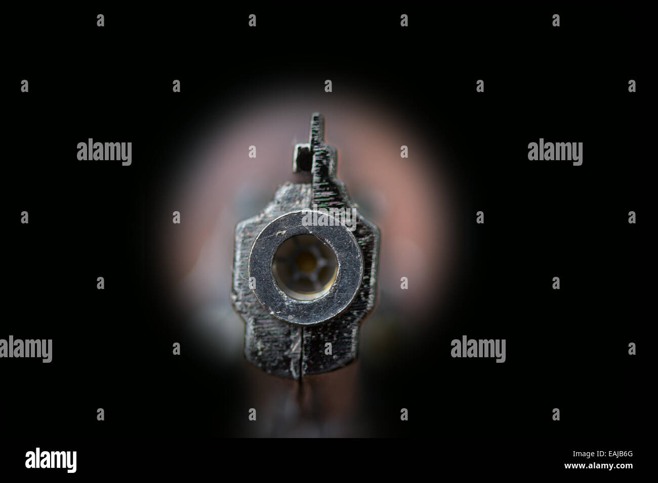 gun in keyhole isolated on black background Stock Photo - Alamy