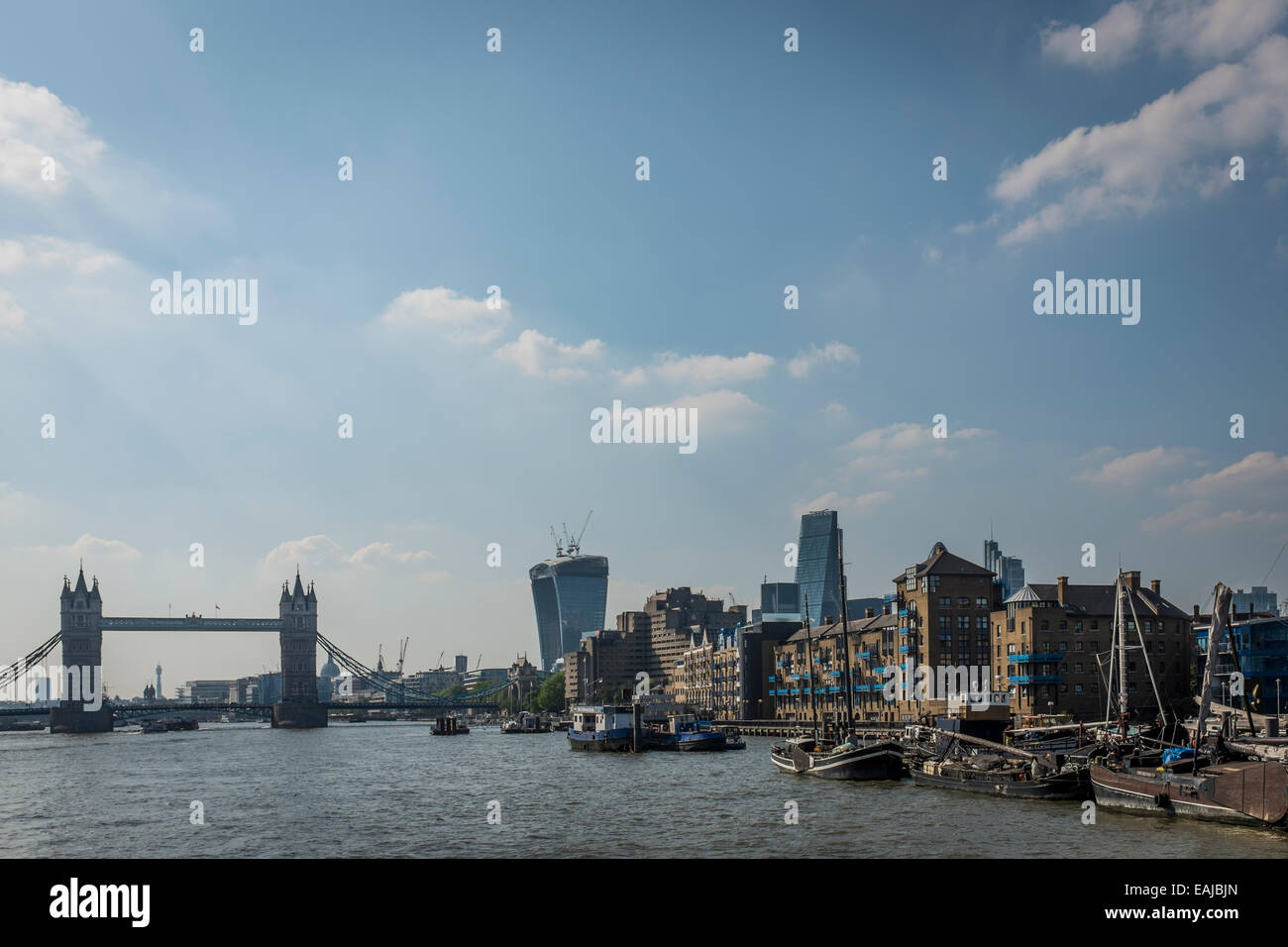 House boats and barges moored at Wapping on the north bank of the River ...