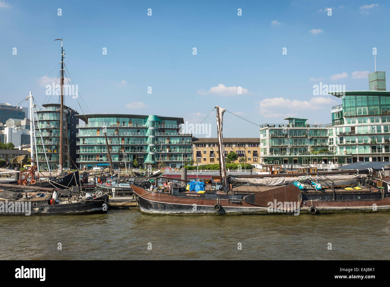 House boats and barges moored at Wapping on the north bank of the River ...