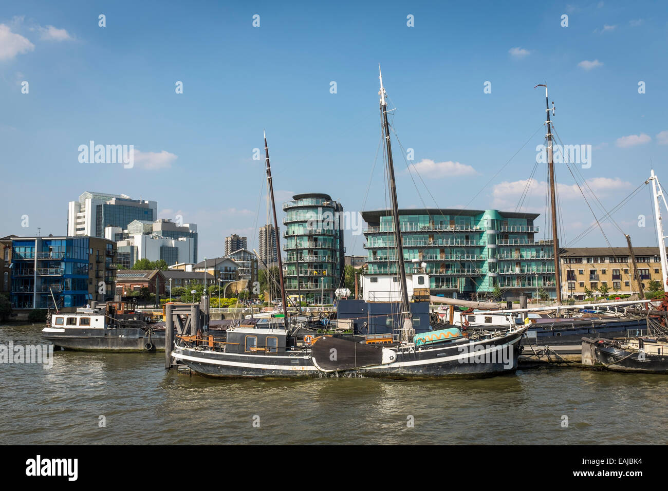 House boats and barges moored at Wapping on the north bank of the River ...