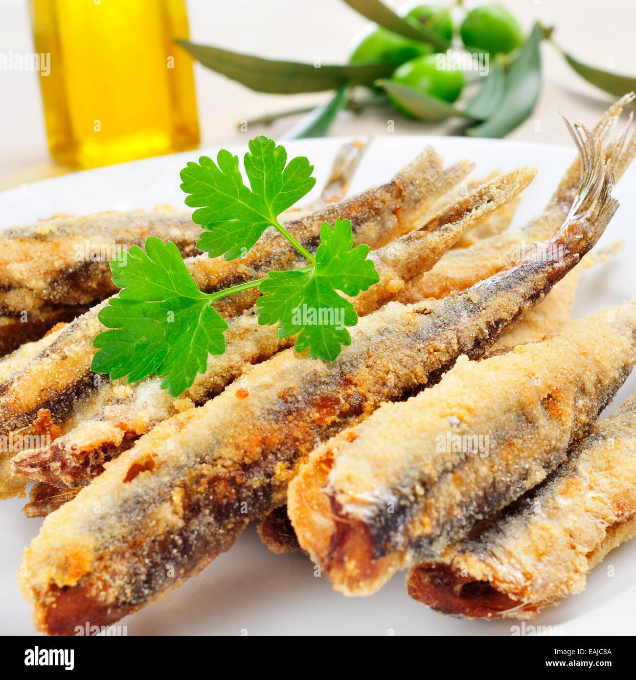 closeup of a plate with spanish boquerones fritos, battered and fried ...