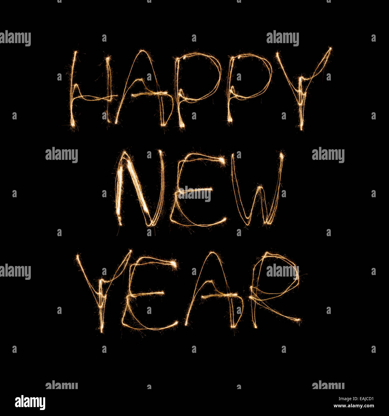 Happy new Year written with a sparkler isolated on black background ...