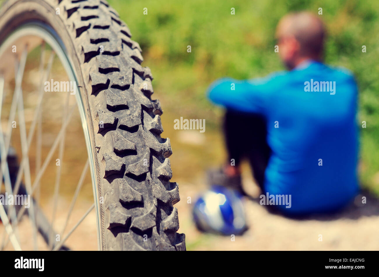 Cyclist resting by river hi-res stock photography and images - Alamy