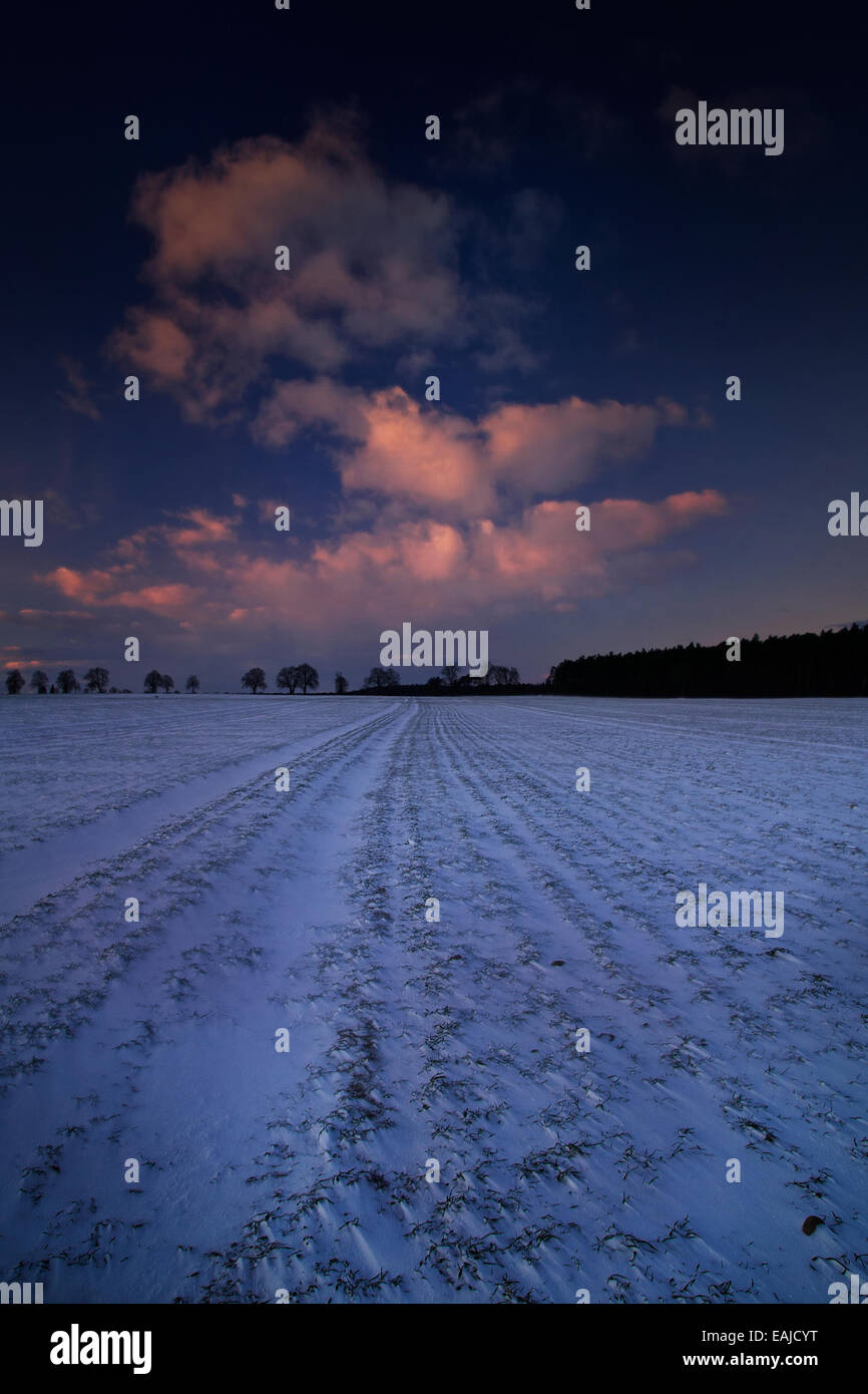 Winter rural landscape of sunset over field Stock Photo - Alamy