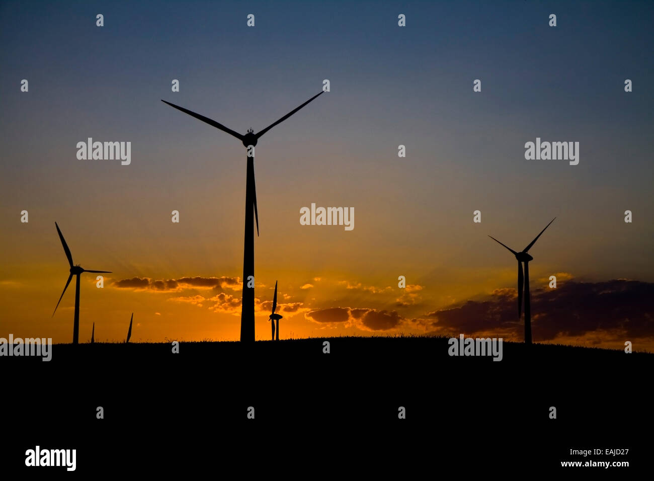 Windmills at evening sky, sunset with clouds Stock Photo - Alamy