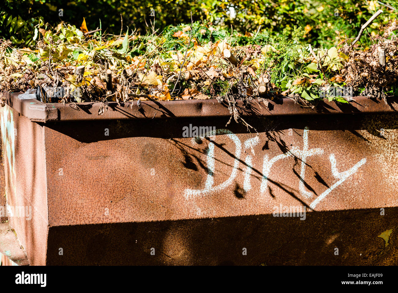 dirty old metal waste container Stock Photo - Alamy