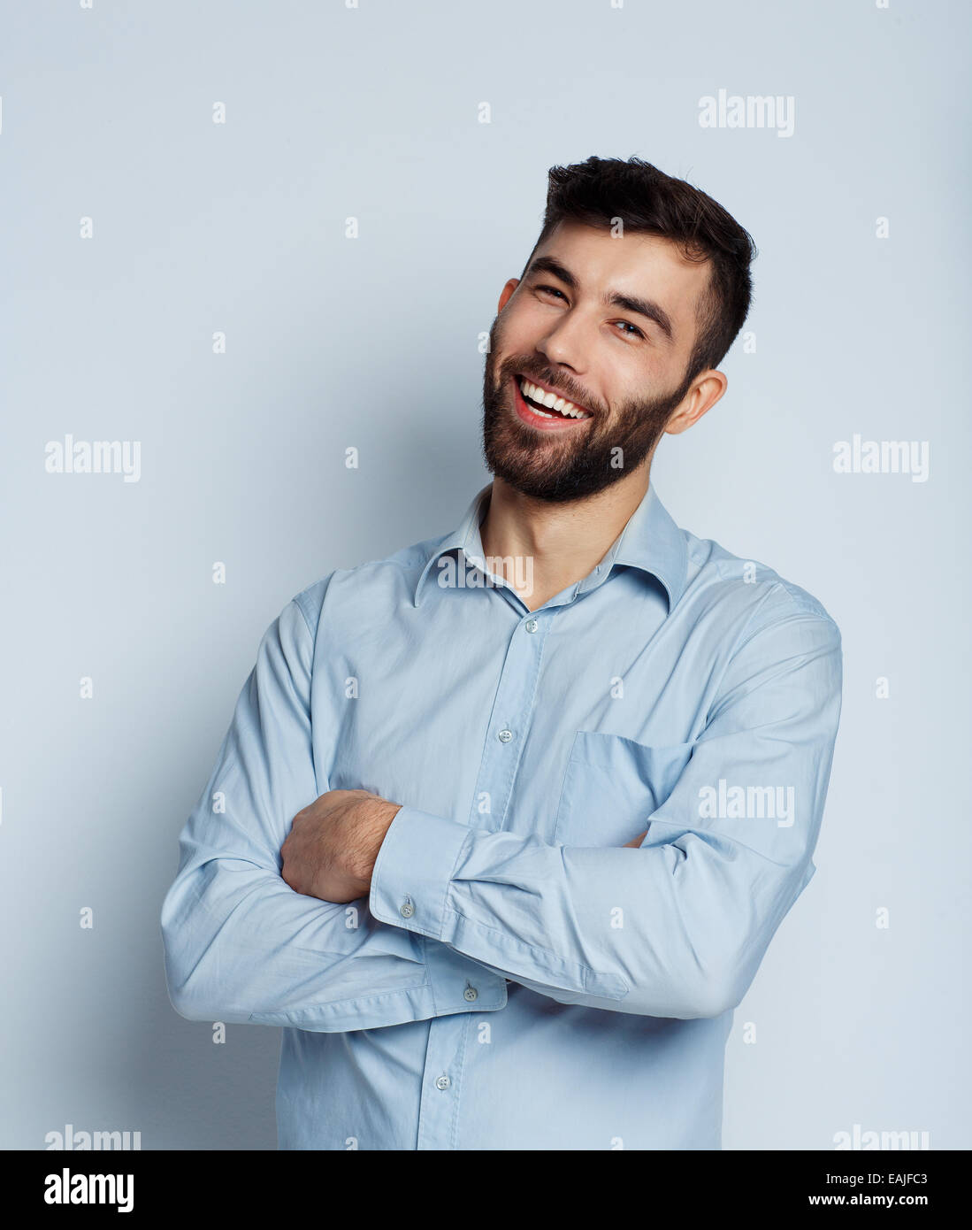 A young bearded man smiling Stock Photo - Alamy