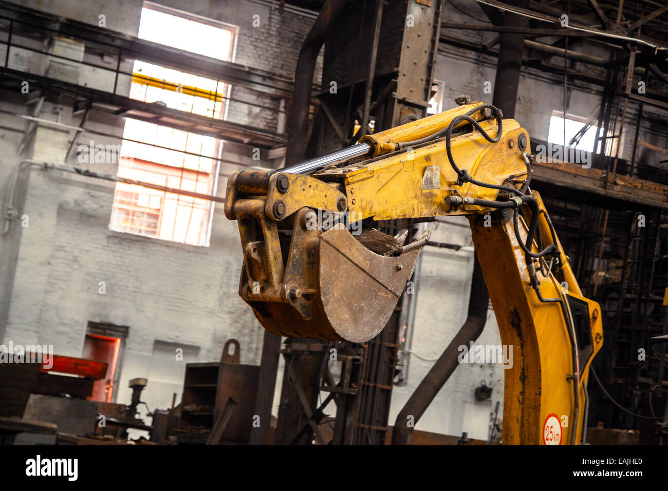 Industrial interior with bulldozer inside Stock Photo - Alamy