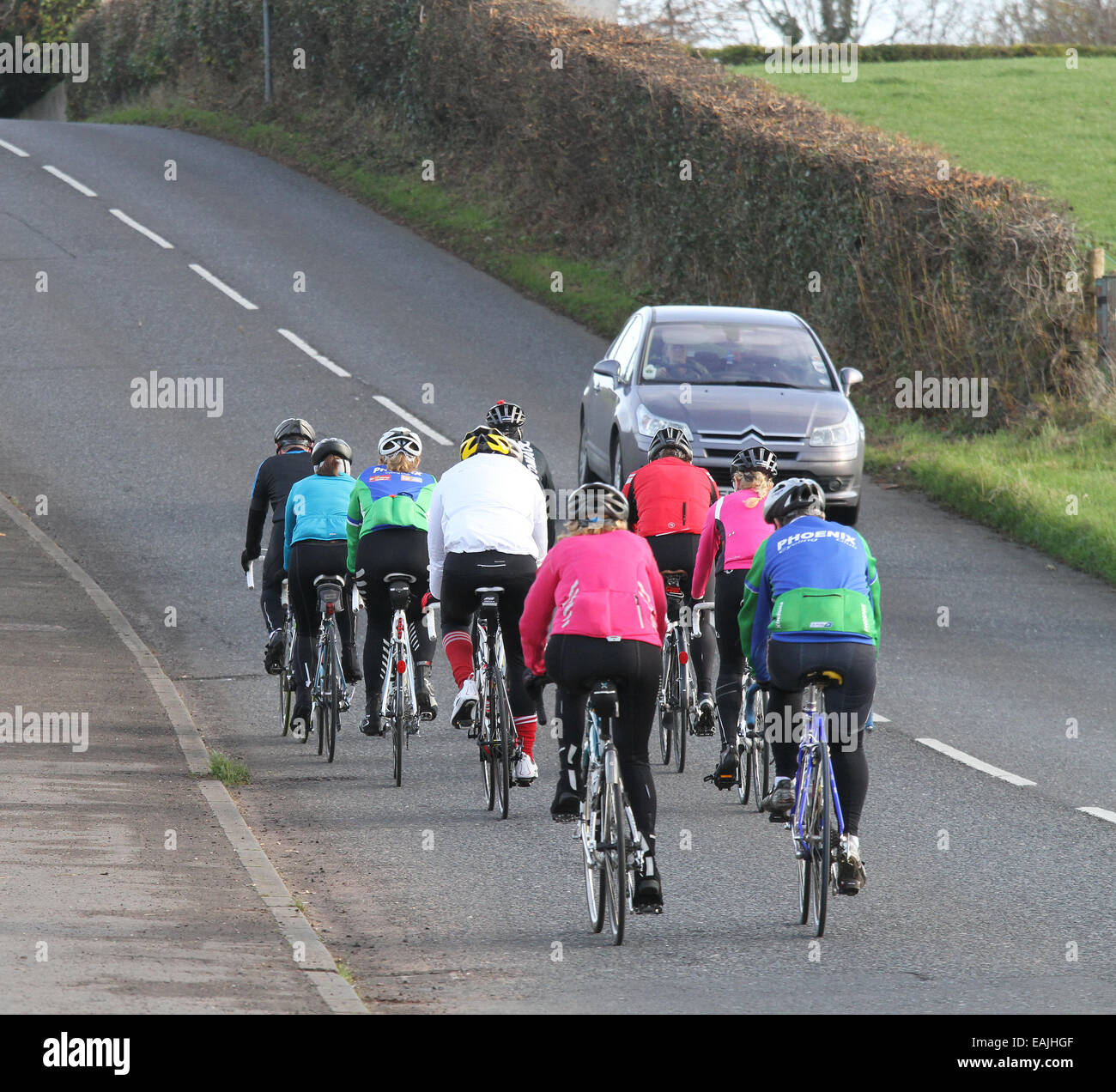 A group of cyclists on a road in Northern Ireland Stock Photo - Alamy
