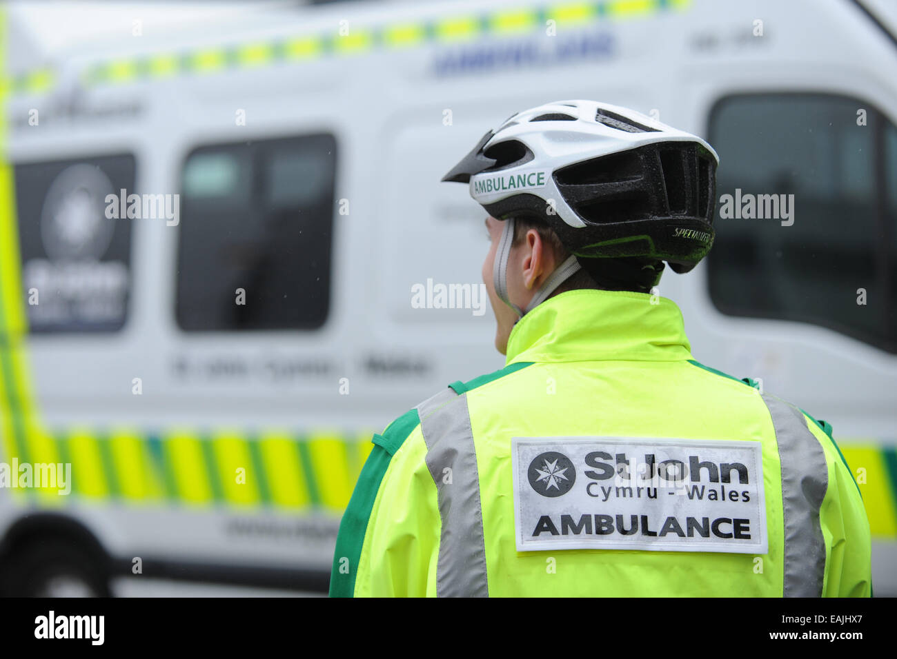 A Welsh St. John Ambulance first responder in front of an ambulance ...