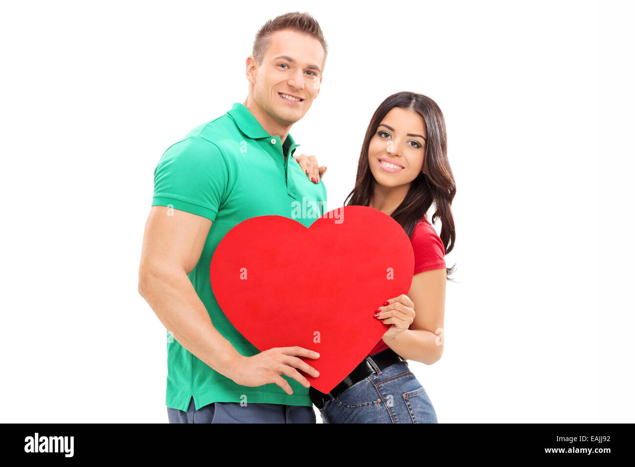 Young couple holding a red heart isolated on white background Stock ...