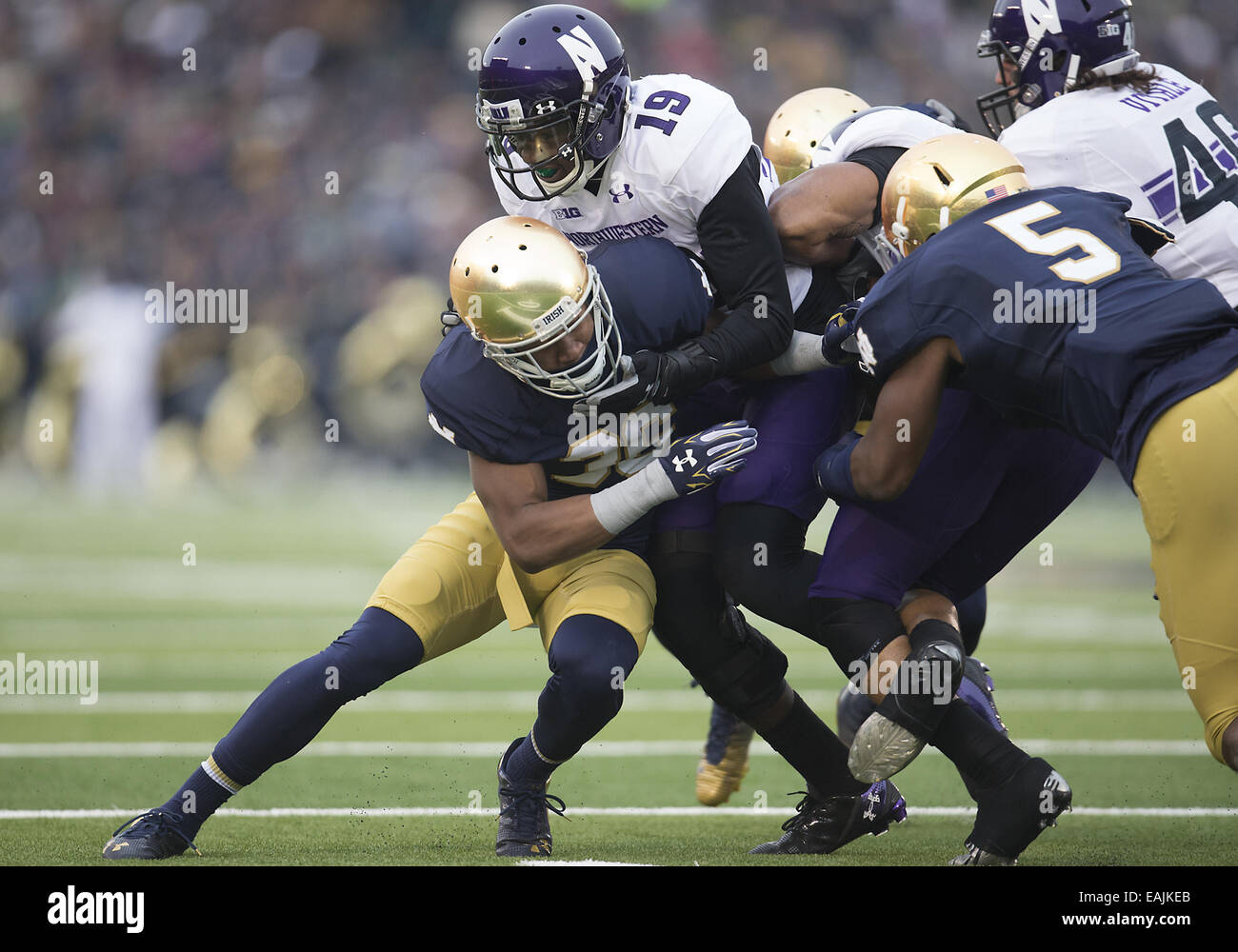 Overtime. 15th Nov, 2014. Notre Dame defenders converge on Northwestern ...