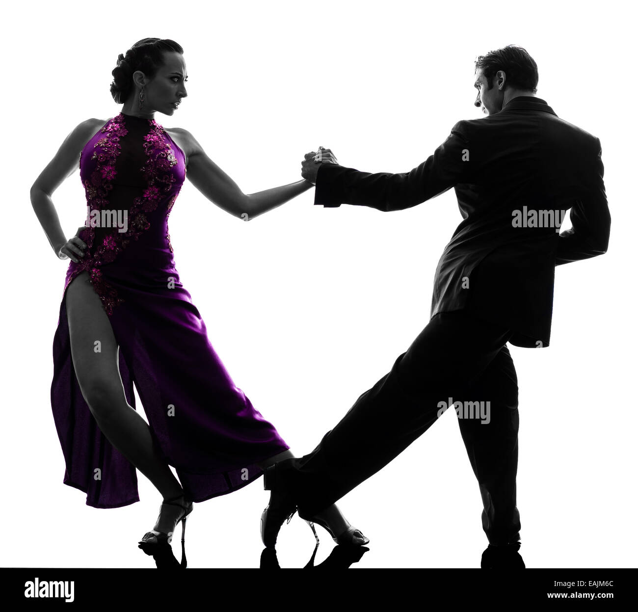 one couple man woman ballroom dancers tangoing in silhouette studio ...