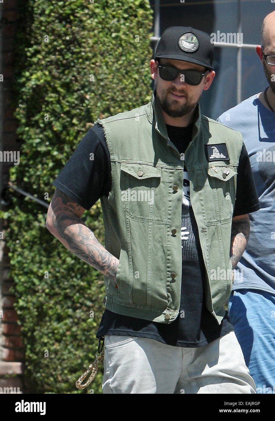 Joel Madden wearing a 'Don't Tread on Me' vest jacket and camouflage ...
