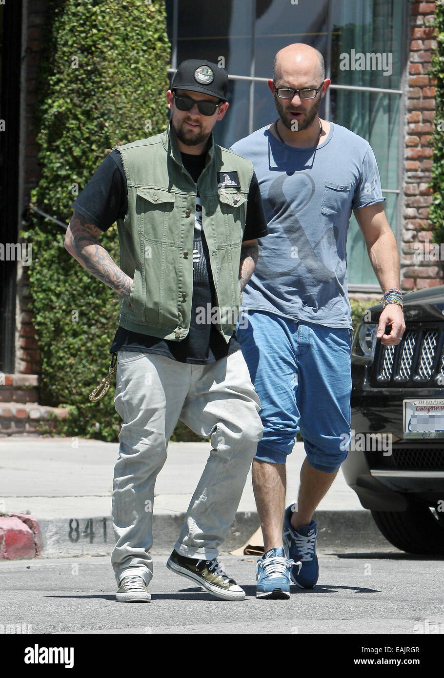 Joel Madden wearing a 'Don't Tread on Me' vest jacket and camouflage ...