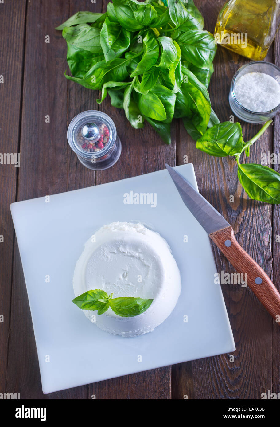 ricotta on the white plate and on a table Stock Photo - Alamy
