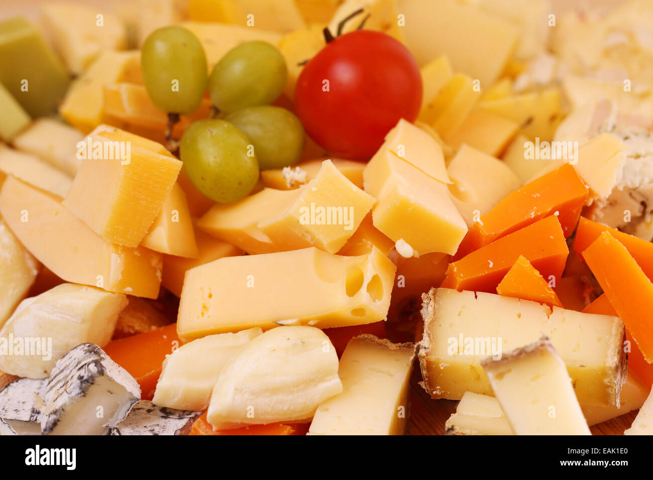Cut french cheese blocks background close-up Stock Photo - Alamy