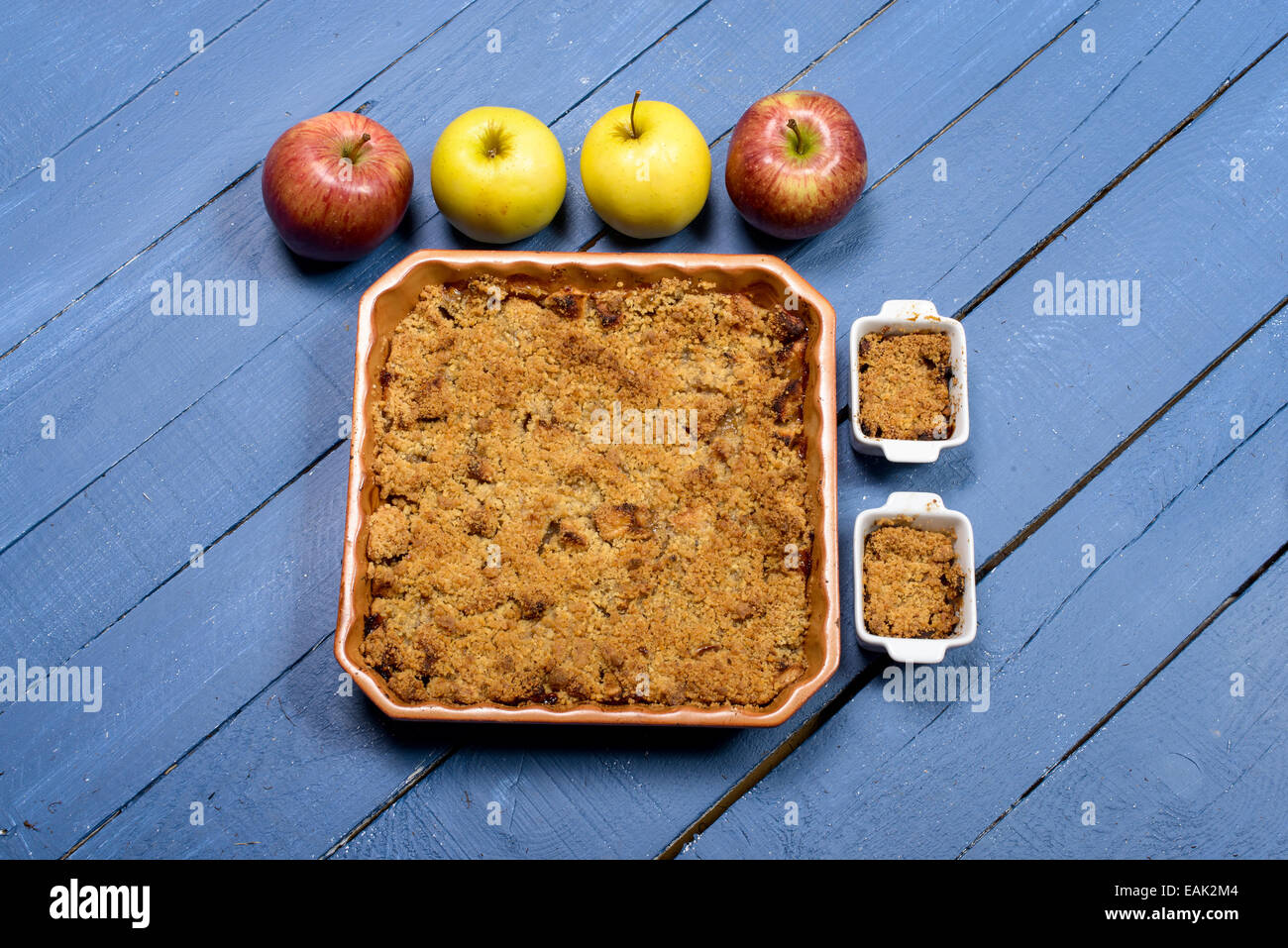 crumble on a wooden table painted blue Stock Photo - Alamy