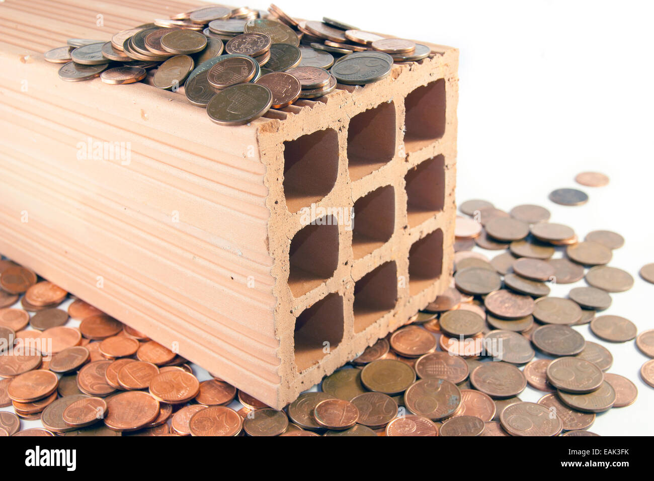 brick laying on euro coins Stock Photo - Alamy