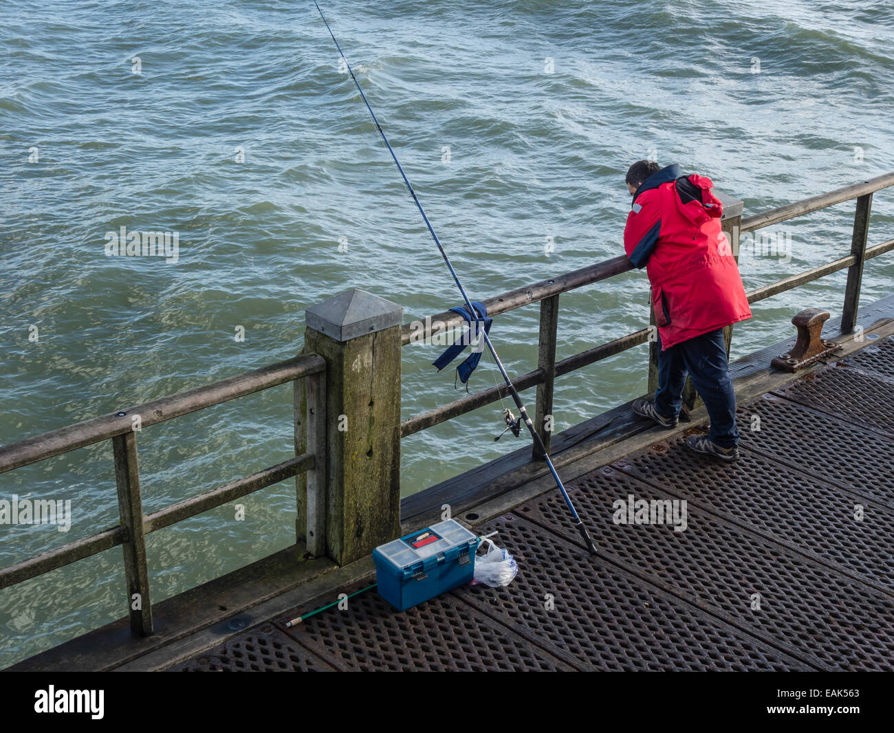 Man Fishing on Bournemouth Pier, Dorset, UK Stock Photo - Alamy