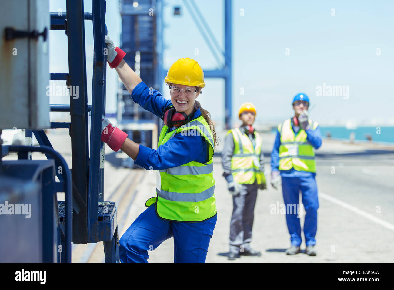 Young worker climbing ladder hi-res stock photography and images - Alamy