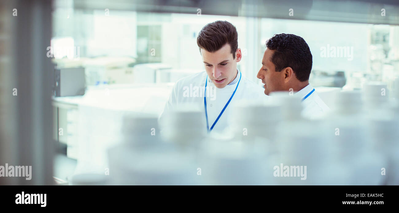 Scientists talking in laboratory Stock Photo - Alamy