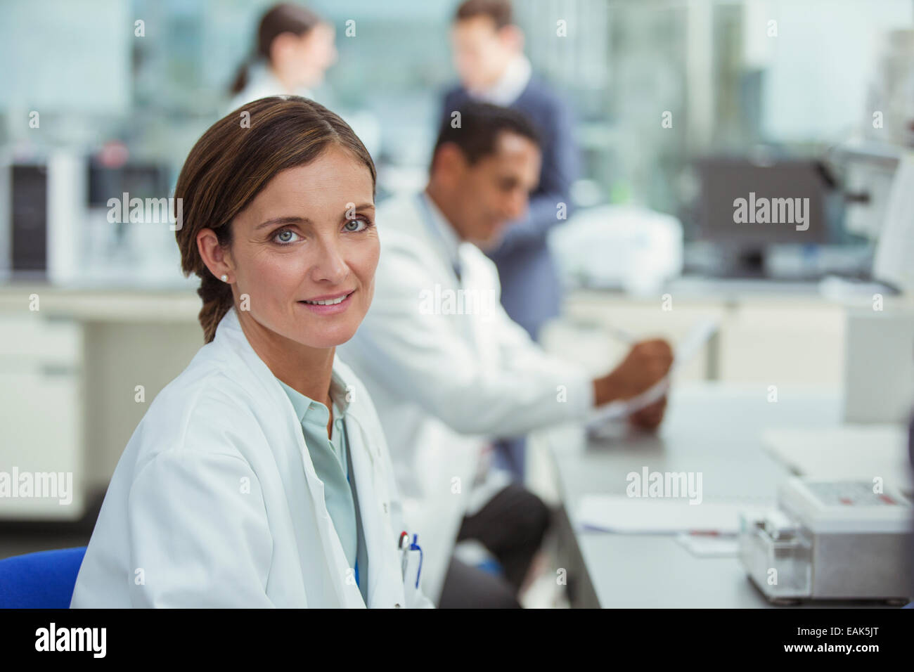 Scientist smiling in laboratory Stock Photo - Alamy