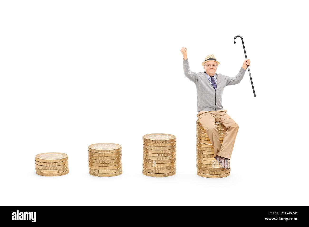 Joyful senior holding cane seated on pile of coins isolated on white ...