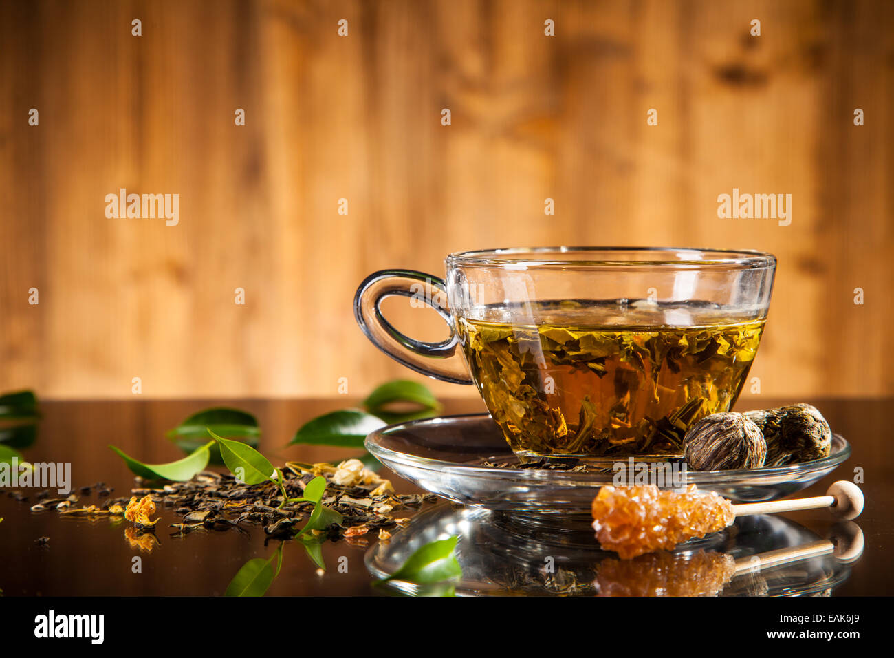 Cup of tea on glass with orange background Stock Photo - Alamy