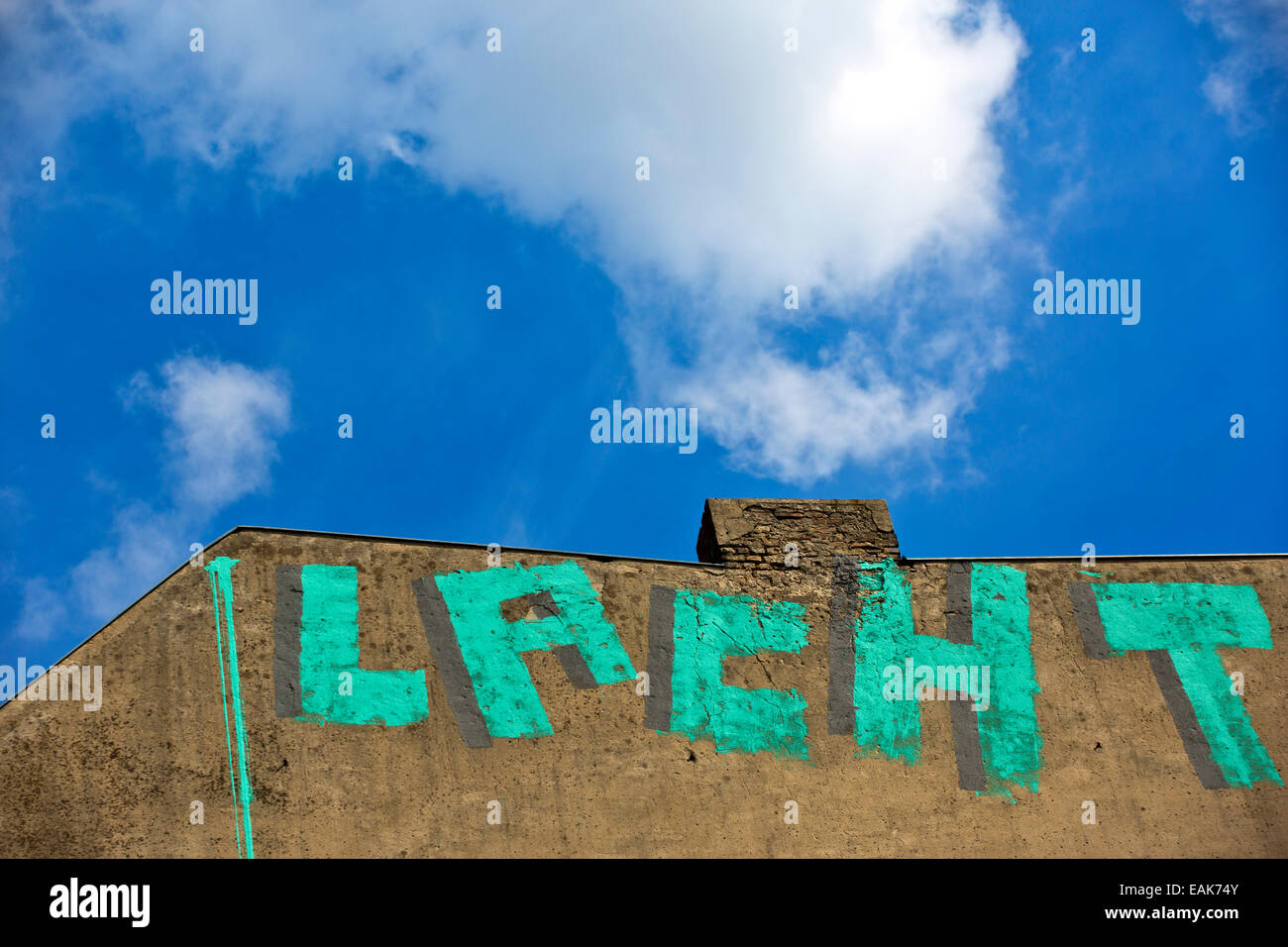 Lettering "Lacht", German for "Laugh" on a house wall, Mitte, Berlin ...
