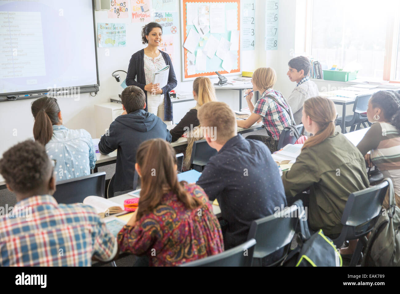 Teacher and students in classroom during lesson Stock Photo - Alamy