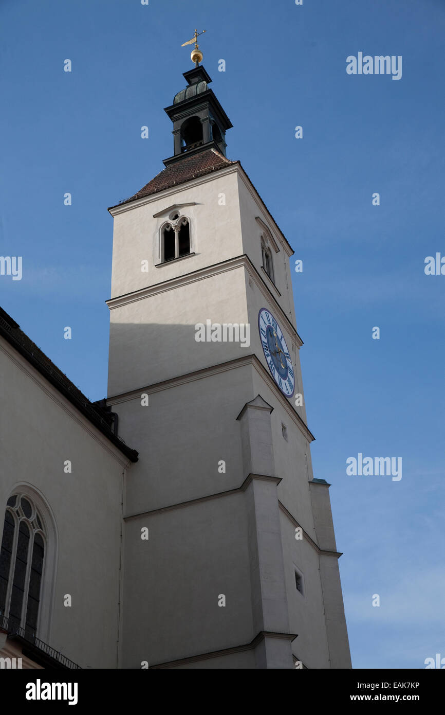 The white clock tower stands out against the beautiful blue sky above ...