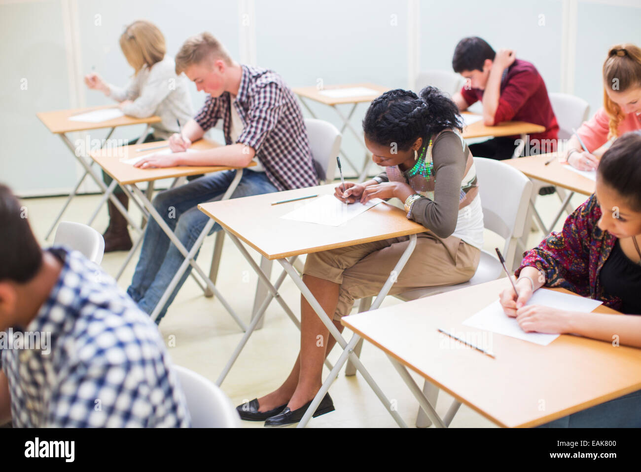 Students writing their GCSE exam in classroom Stock Photo - Alamy