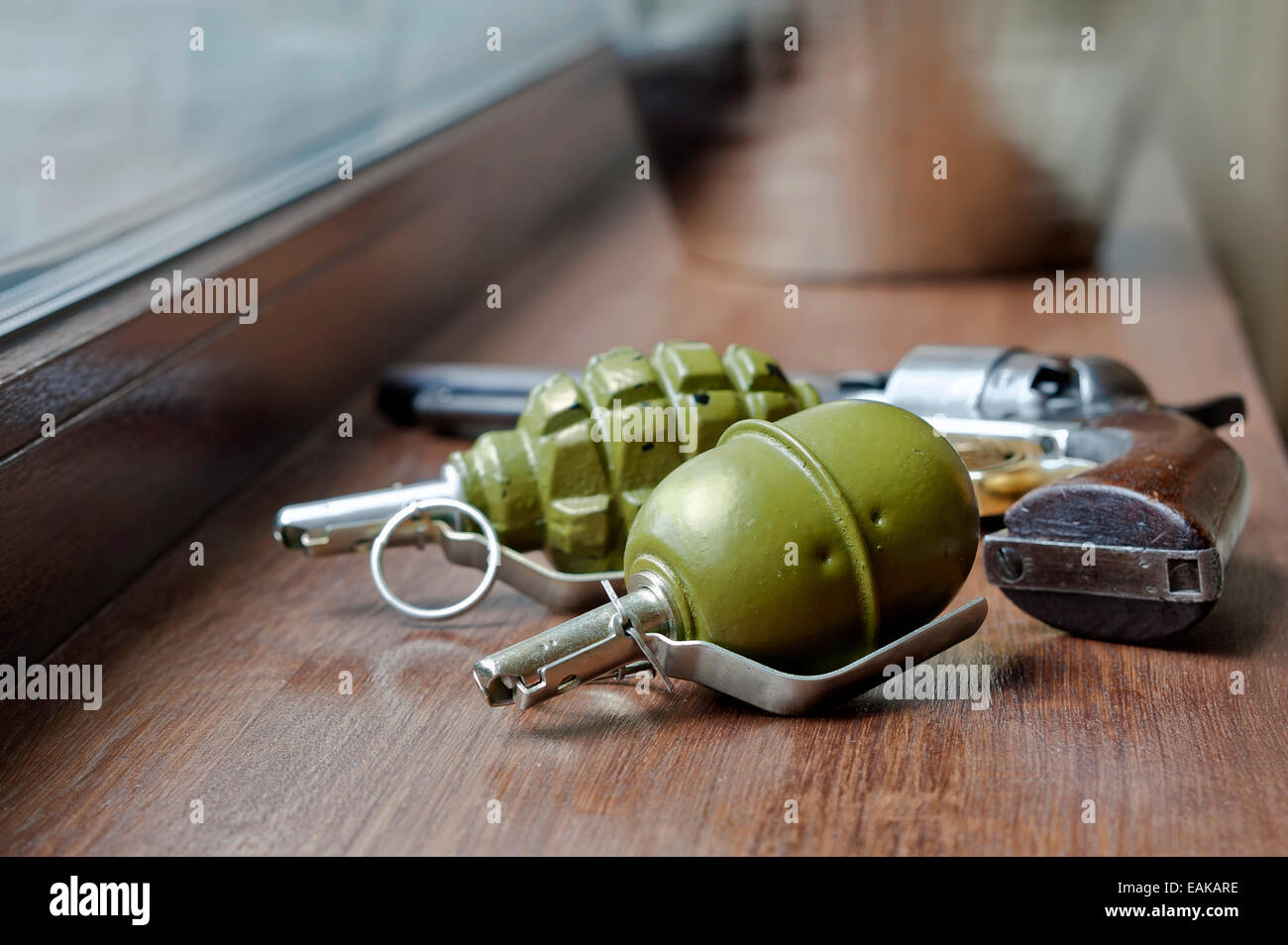 Grenades and Hand Gun Stock Photo - Alamy