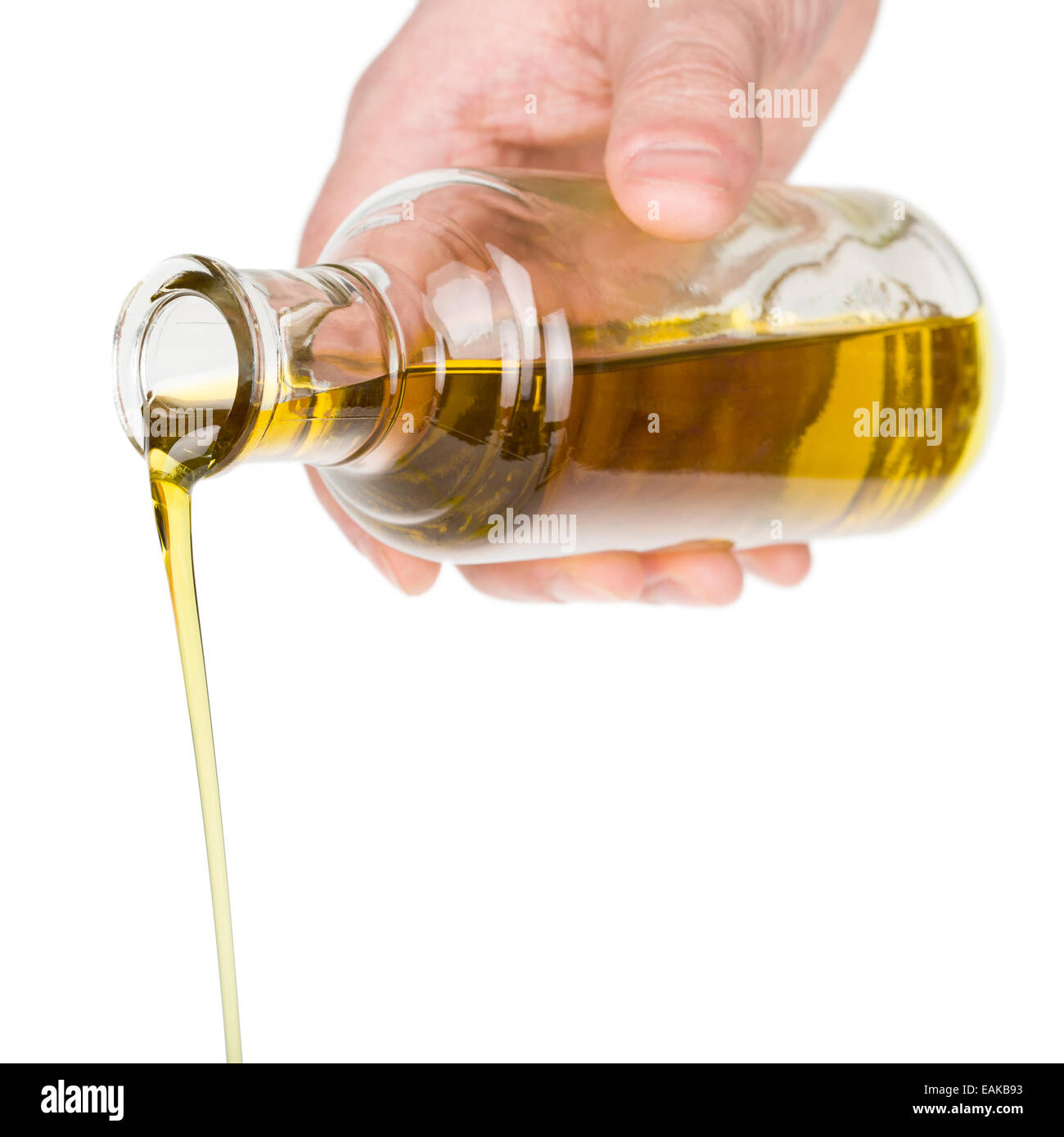 Pouring yellow liquid from Cut Out Stock Images & Pictures - Alamy